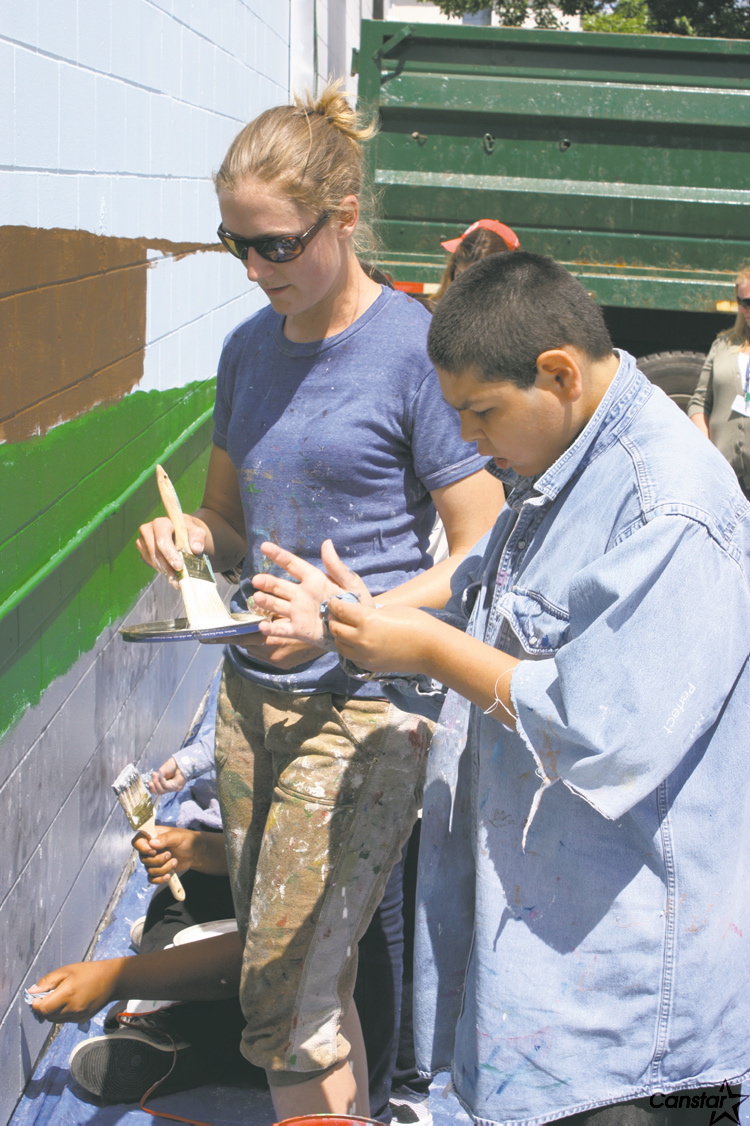 Second mural rises on Elmwood building – Our Communities