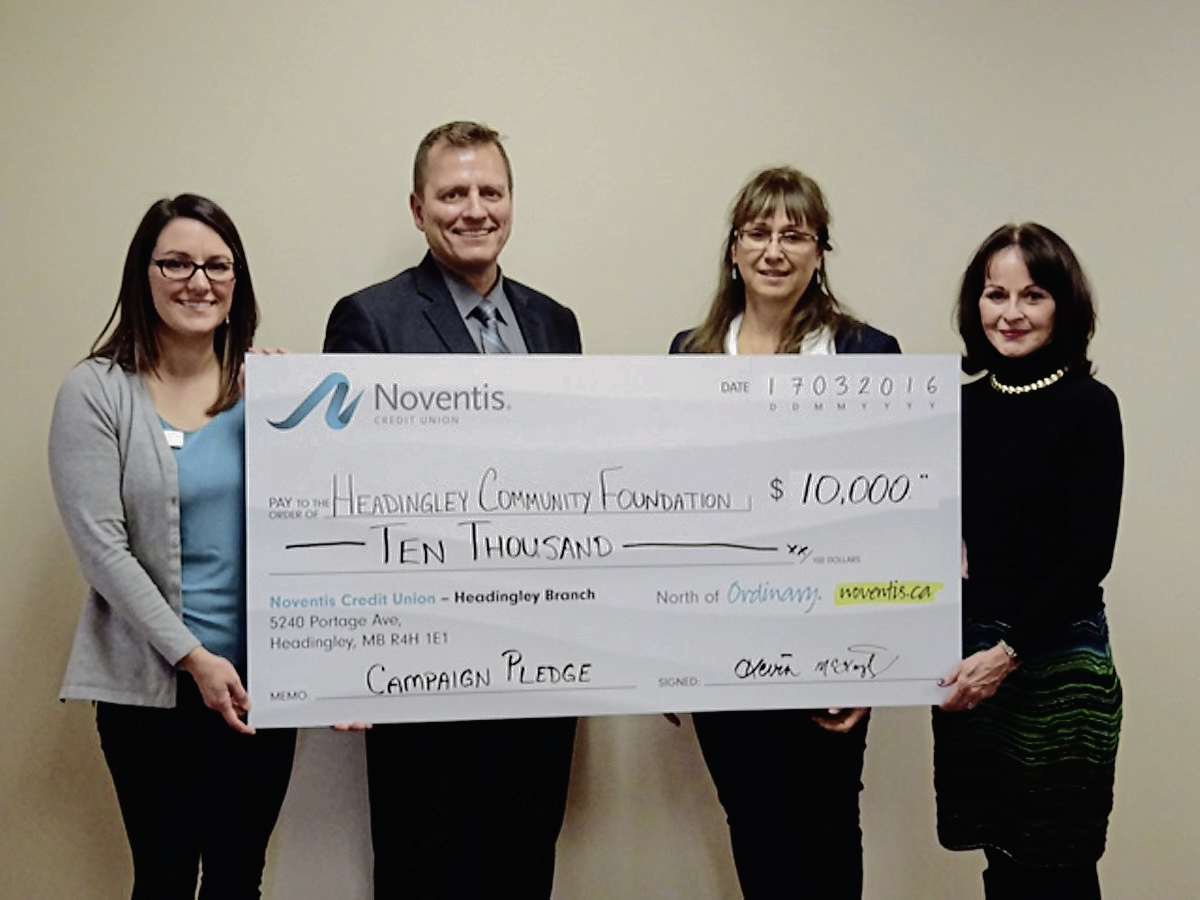 Presenting a big donation – Our Communities