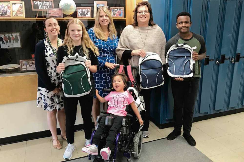 Happy to present some kits to kids – Our Communities