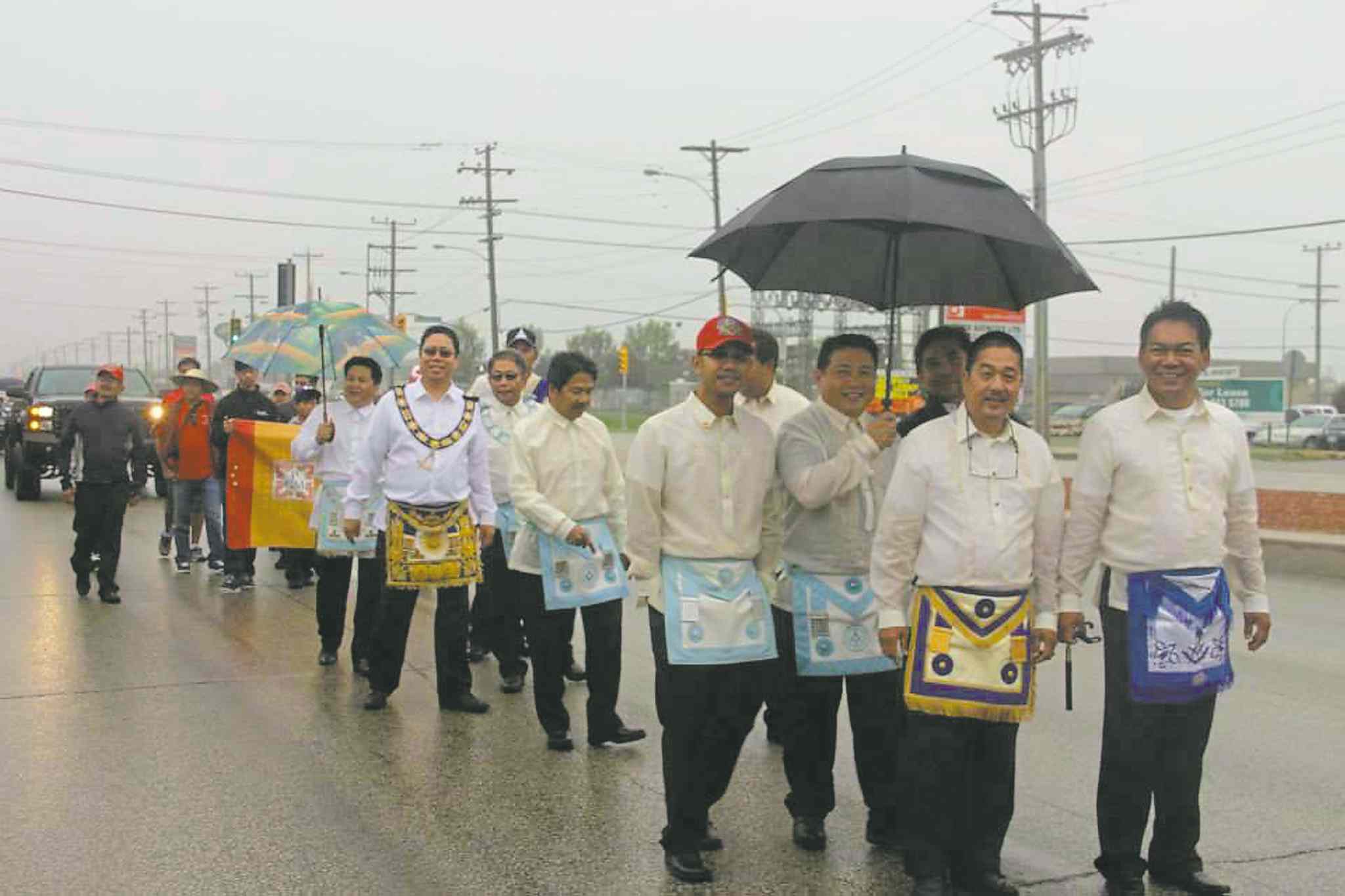 Masons march in the rain – Our Communities
