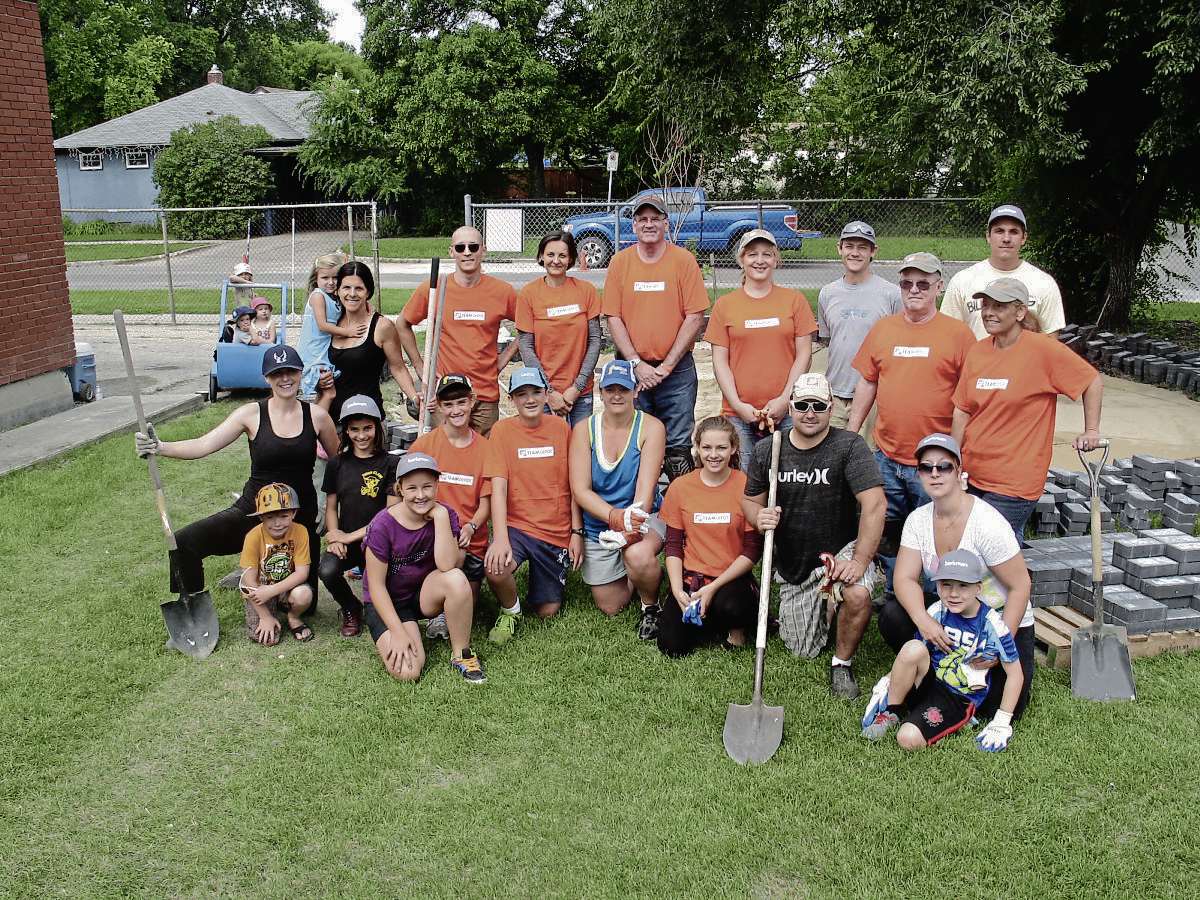 Sharing the load to build brick circle – Our Communities