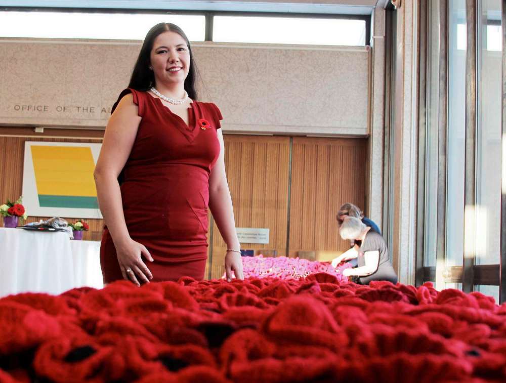 Memory weaved into handmade poppy blanket – Our Communities
