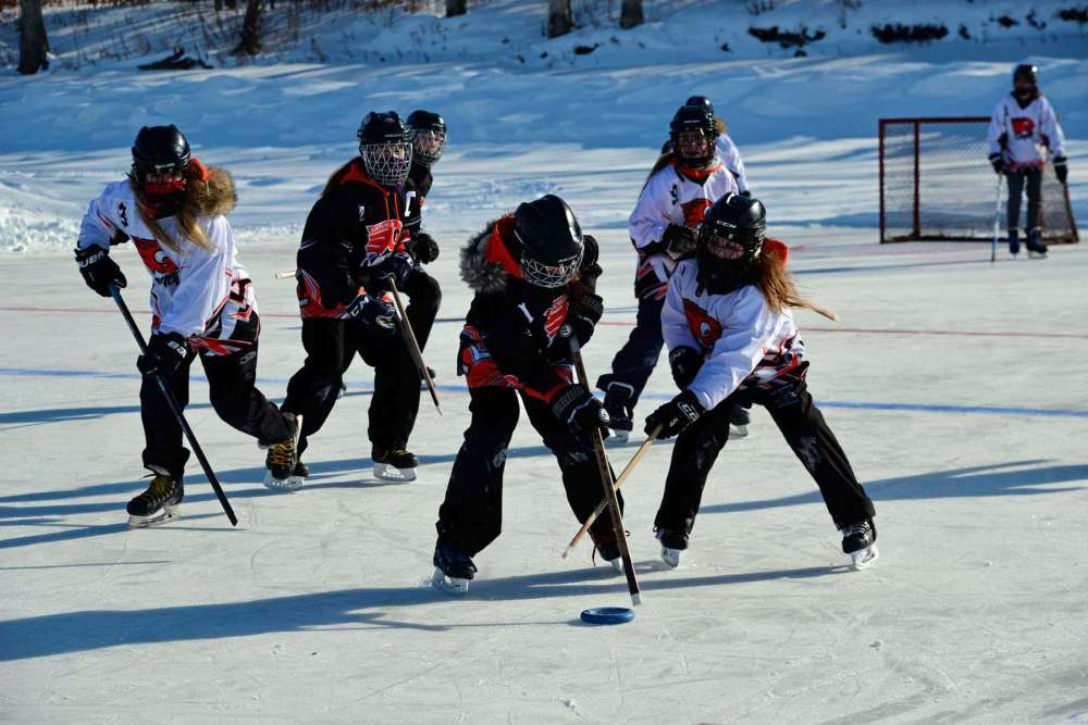 Playing ringette by the river – Our Communities