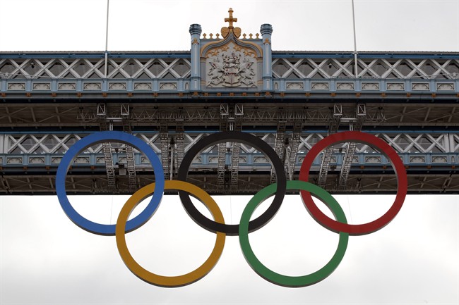 Ring in the games: Giant Olympic symbols hung from Tower Bridge signals ...
