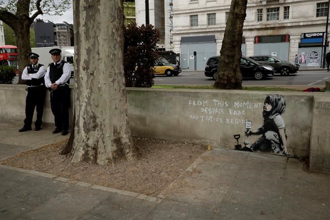 Climate mural emerges after London protests; Is it Banksy? – Winnipeg ...