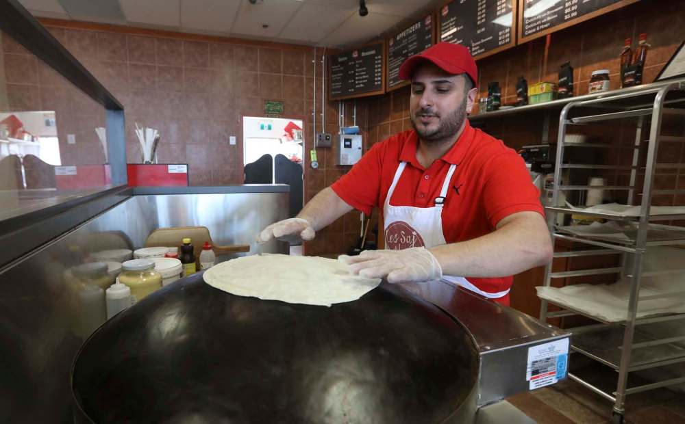 Breaking the bread – Winnipeg Free Press