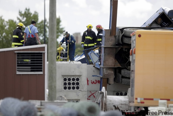 Crane tips over, trapping operator – Winnipeg Free Press