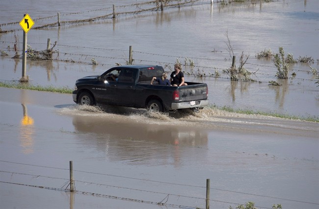 If you stay in flood zone, there will be consequences, Alberta ...