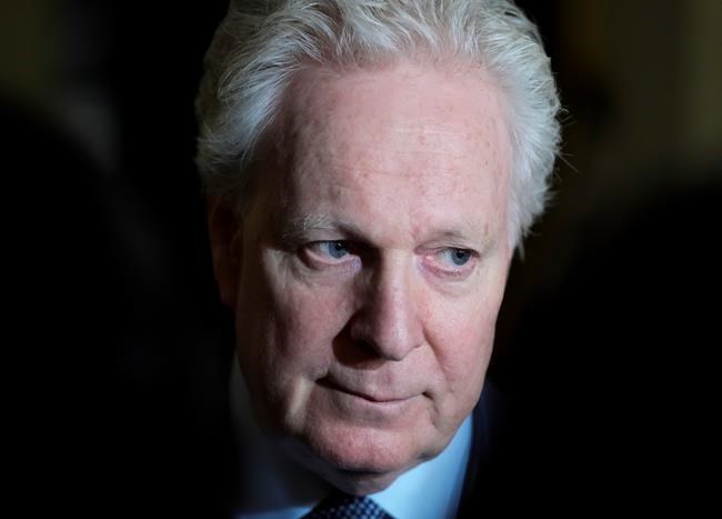 Former Quebec premier Charest brings both notoriety and baggage to ...