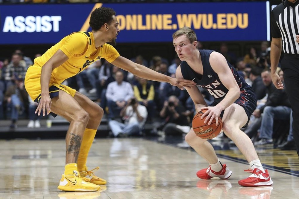 Huggins reaches another coaching milestone, WVU beats Penn – Winnipeg ...