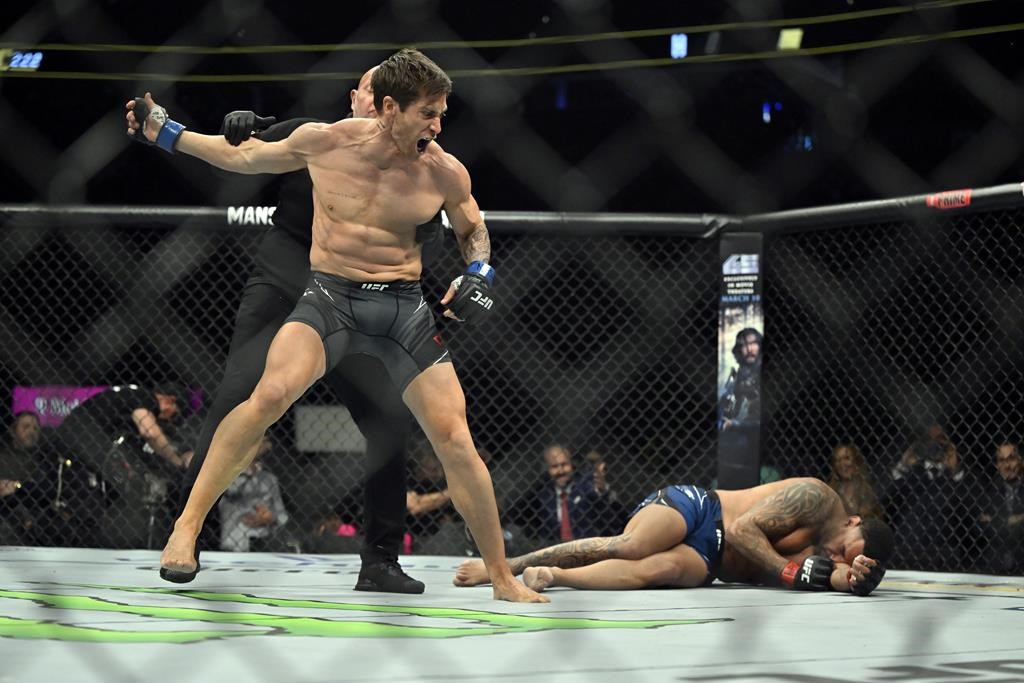 Jon Jones returns to win UFC heavyweight title in 1st round – Winnipeg ...