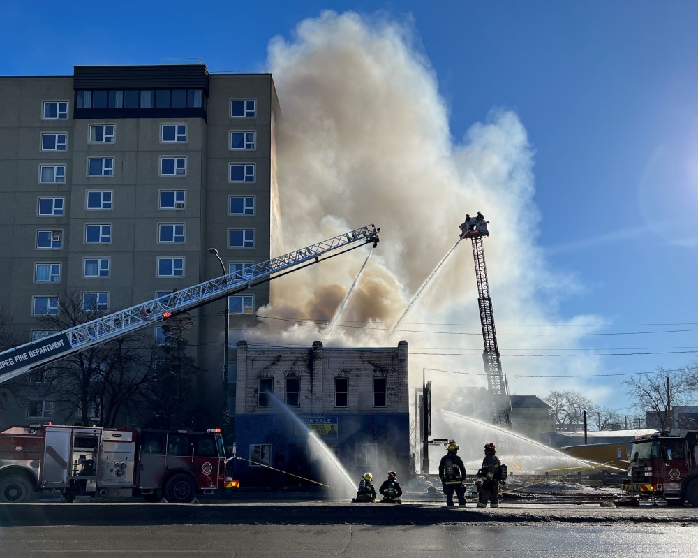 Main Street closed between Higgins and Dufferin as crews battle fire ...