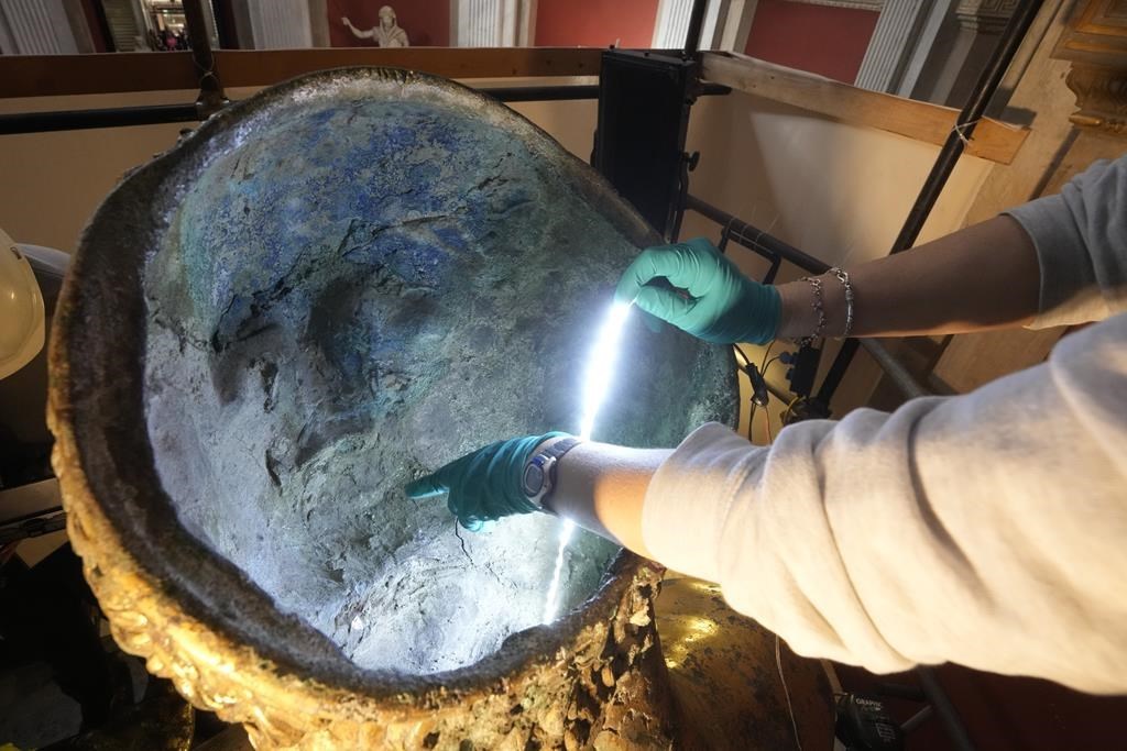 Vatican experts uncovering gilded glory of Hercules statue struck by ...