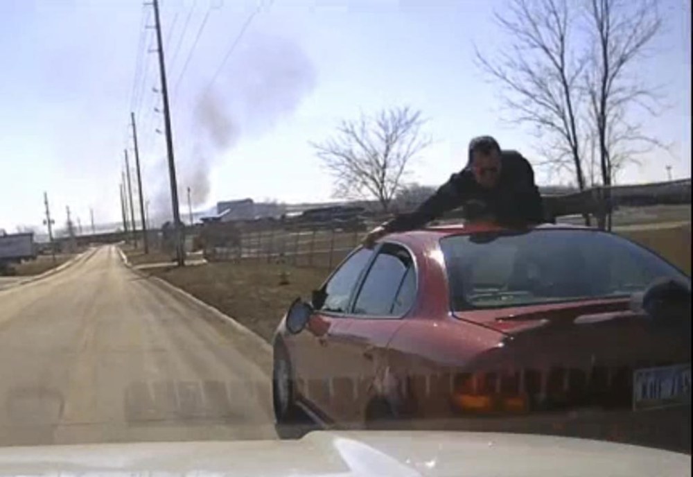 Video shows driver fleeing Iowa police with officer on hood, roof of ...