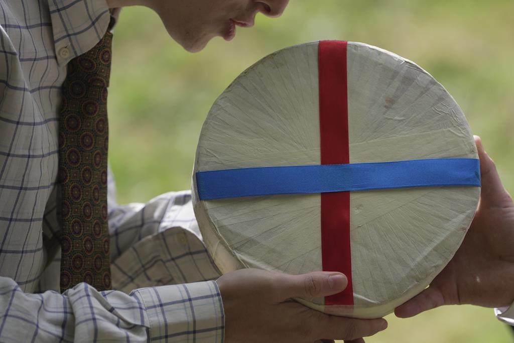 Rolling thunder: Contestants chase cheese wheel down a hill in chaotic ...