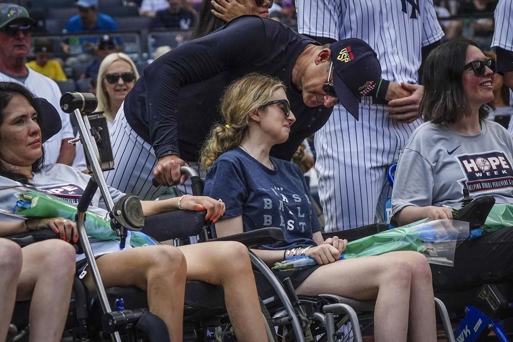MLB’s Sarah Langs, who has ALS, honored at Yankees game on anniversary ...