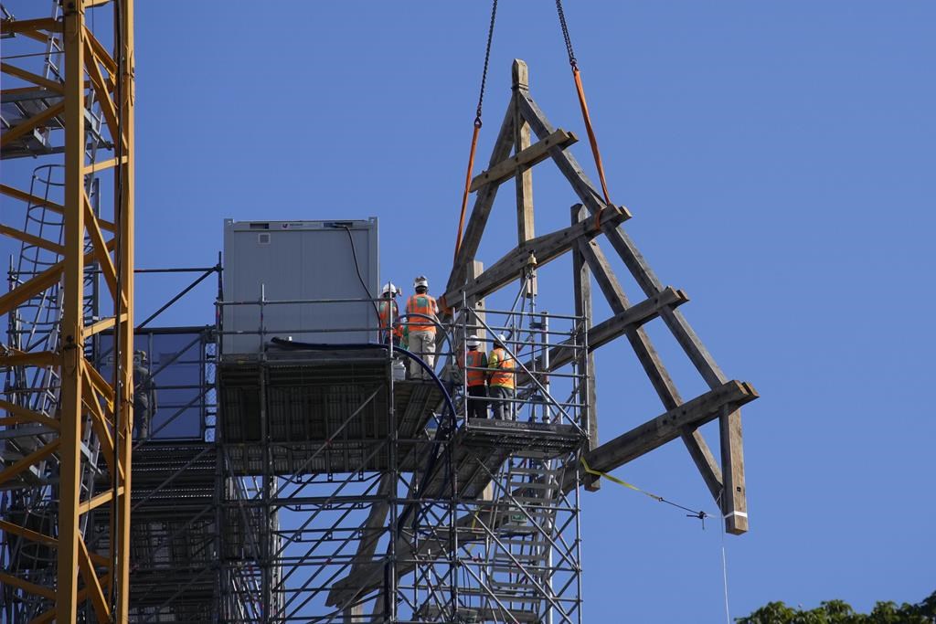 Oak trusses raised to roof of fire-ravaged Notre Dame Cathedral as ...