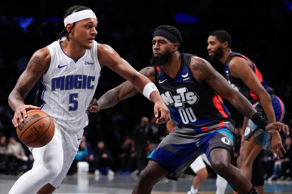 Nets pull away in fourth quarter for a 124-104 victory over Magic in ...