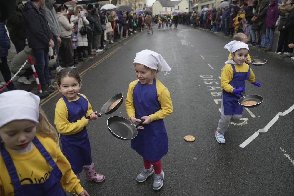 In this centuries-old English pancake race, ‘you just have to go flat ...