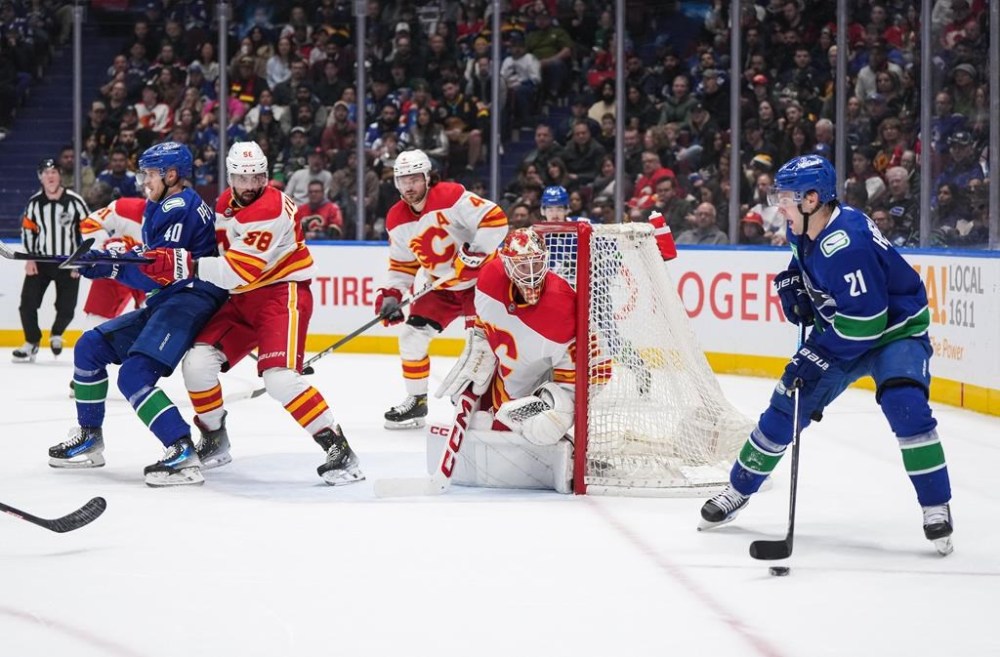Hoglander scores twice as Vancouver Canucks double up Calgary Flames 4 ...