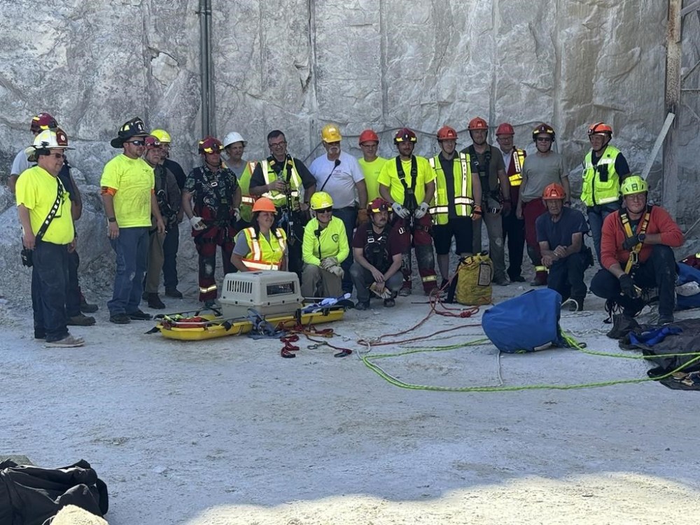Rope team rappels down into a rock quarry to rescue a mutt named Rippy ...