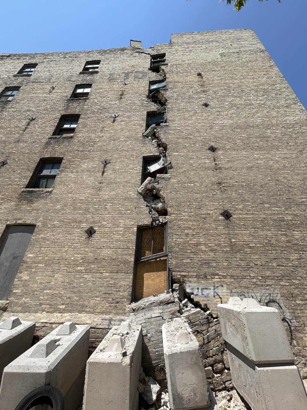 Neighbours forced out as bricks fall from five-storey building ...