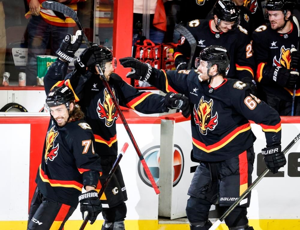 Dustin Wolf solid as Flames hang on for 2-1 shootout win over Islanders ...