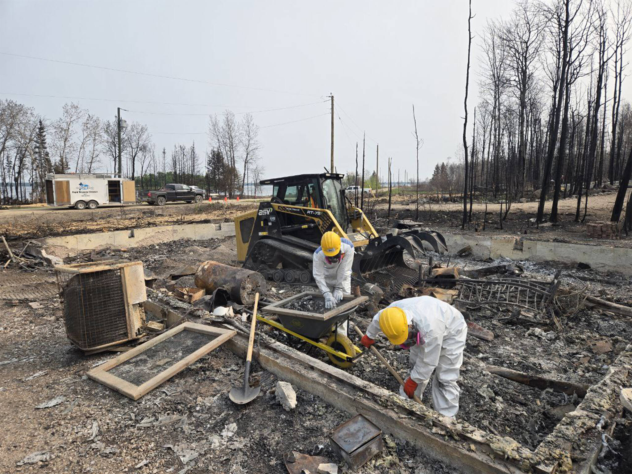 Out-of-town volunteers sift through rubble to clean up Wendigo Road ...