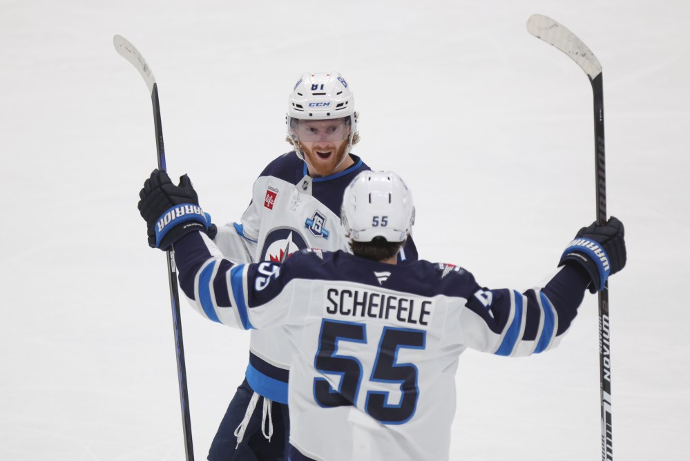 Connor scores twice as the Jets beat the Blue Jackets 2-1 to stay in ...