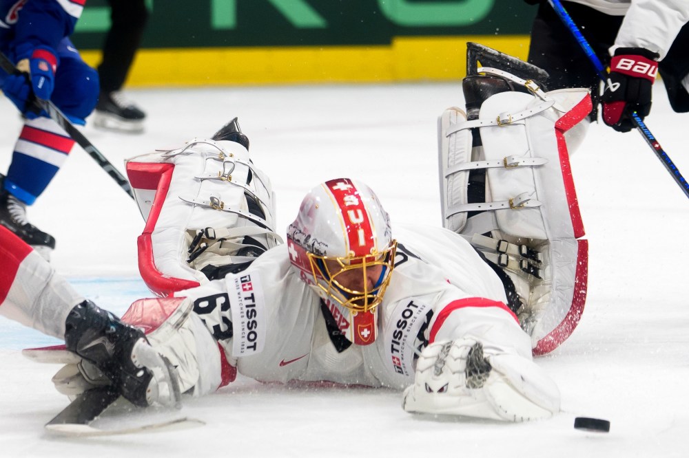 Switzerland beats defending champion the US in ice hockey worlds opener ...
