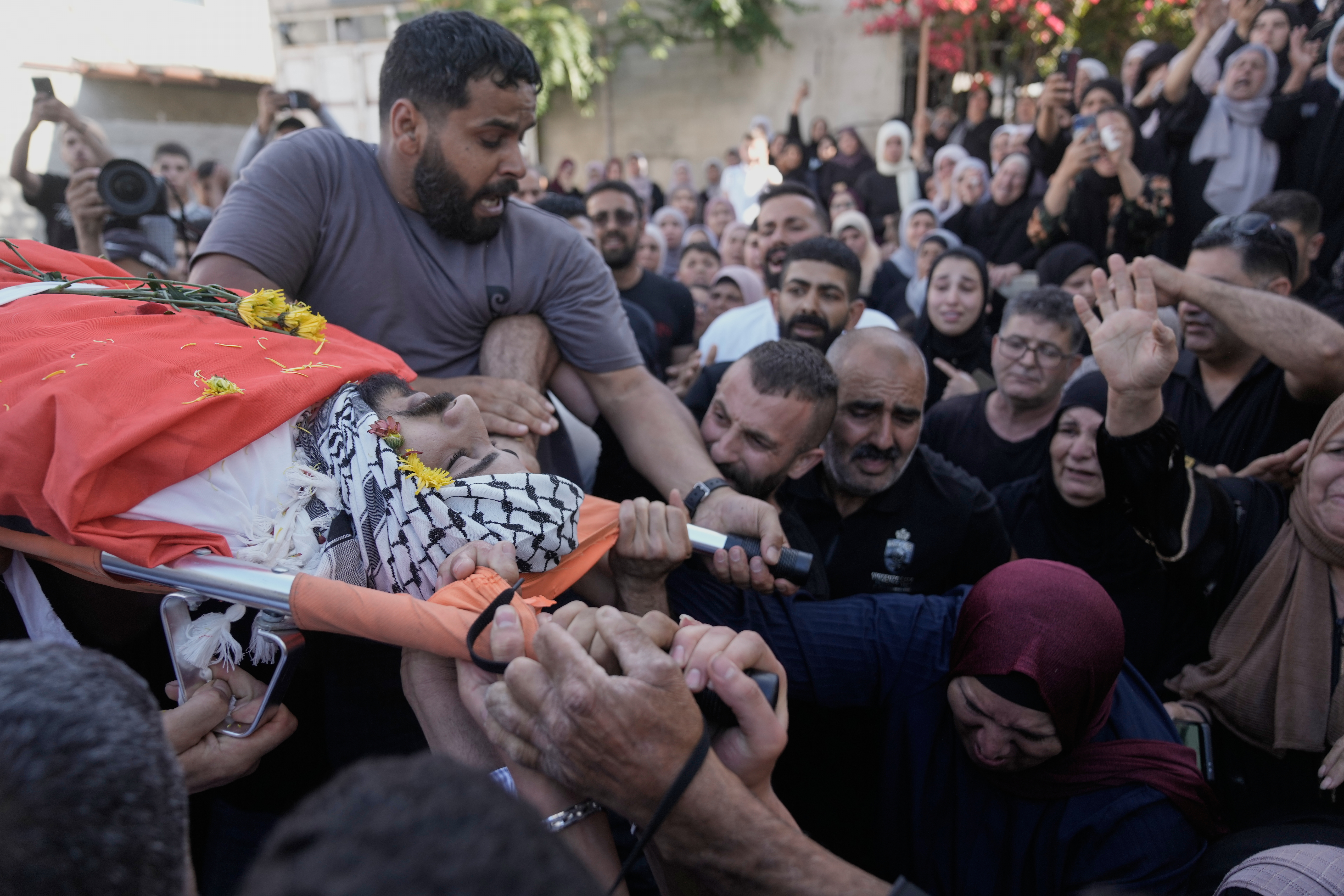 Palestinian man is shot and killed at a West Bank barrier near ...