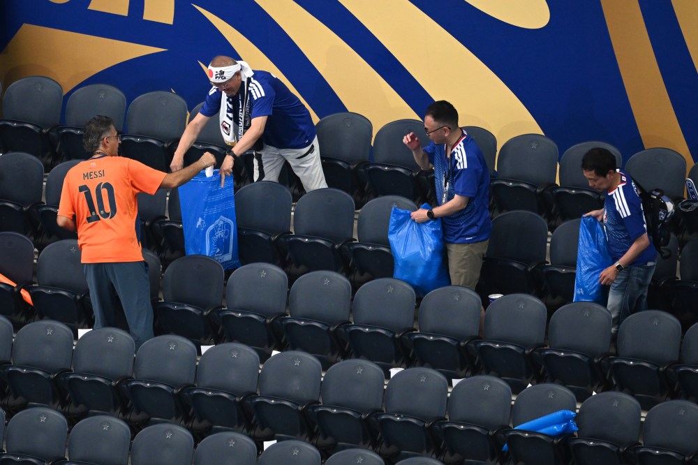 Japan fans use blue bags to uphold a cleansing World Cup tradition ...